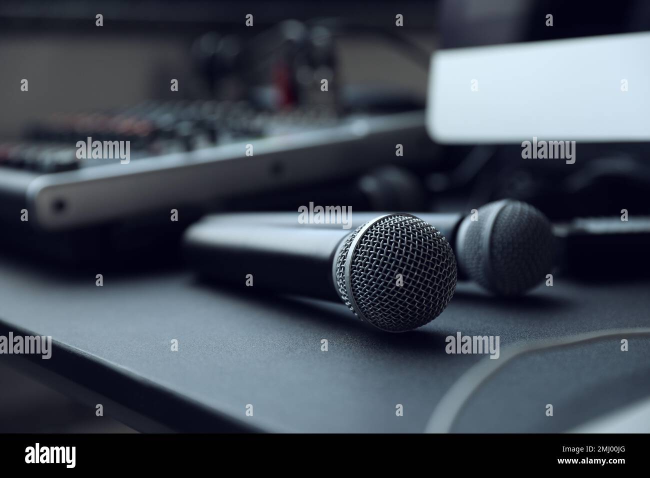 Modern microphone on black table indoors, closeup Stock Photo - Alamy
