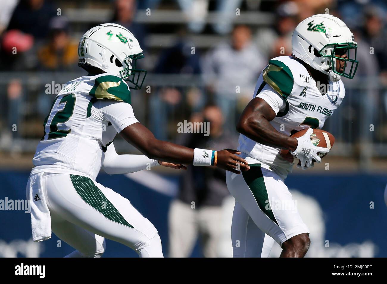 South Florida quarterback Jordan McCloud (12) hands off to running back ...