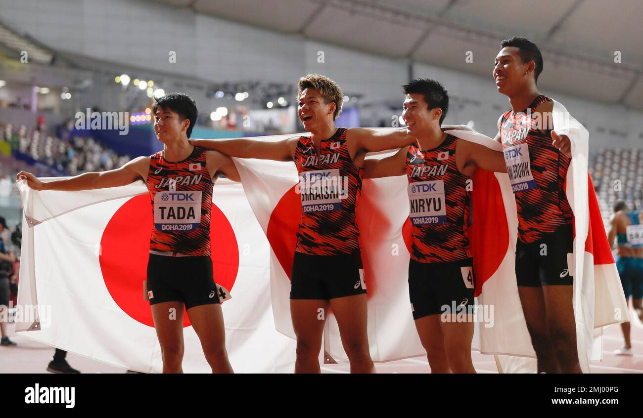 The Japanese team celebrate their bronze medal in the men's 4x100 meter ...