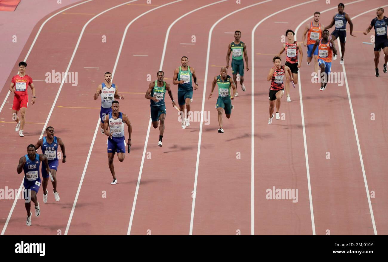 Competitors run in the men's 4x100 meter relay final at the World ...