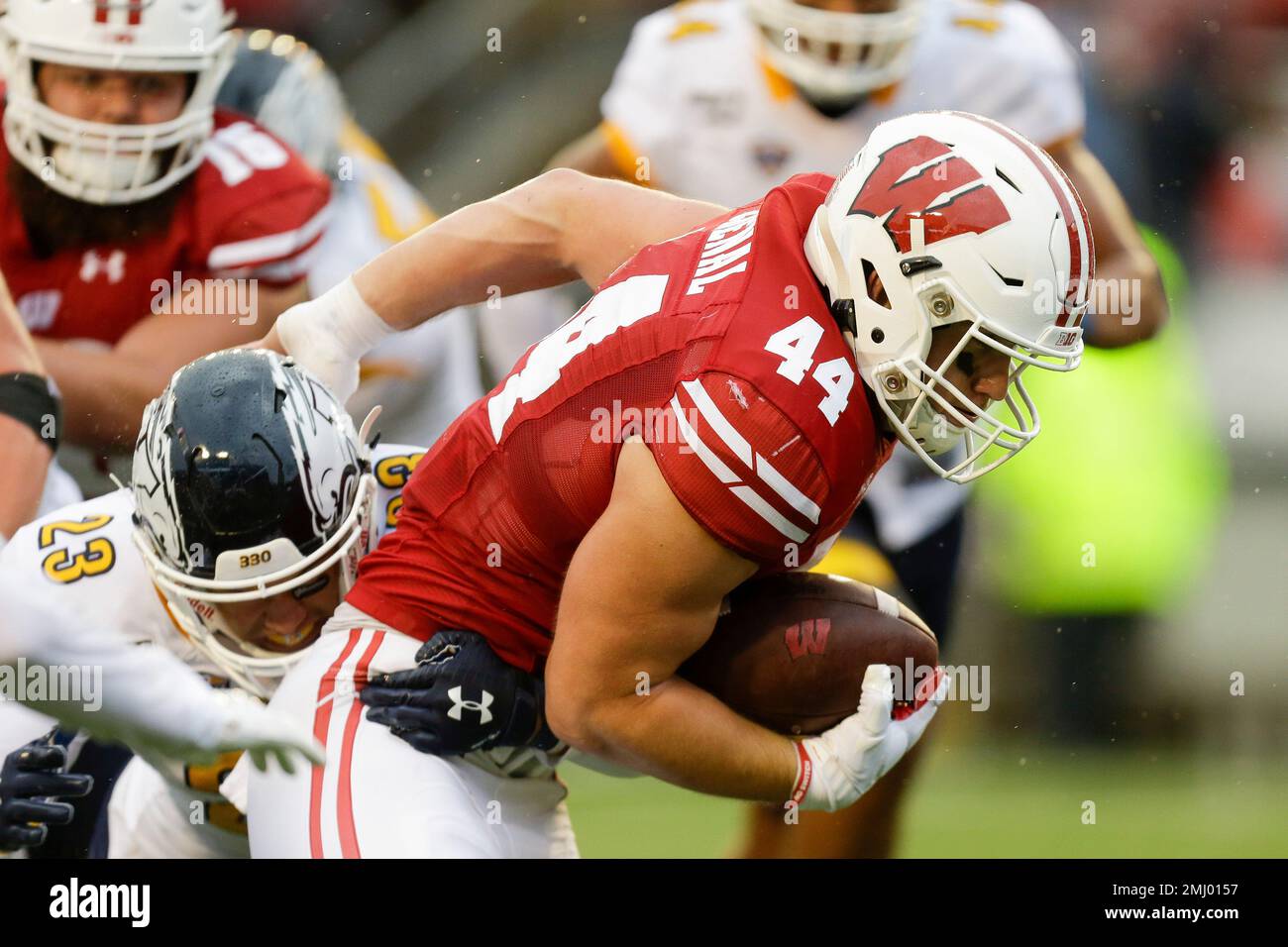 Wisconsin fullback John Chenal (44) runs against Kent State safety Dean ...