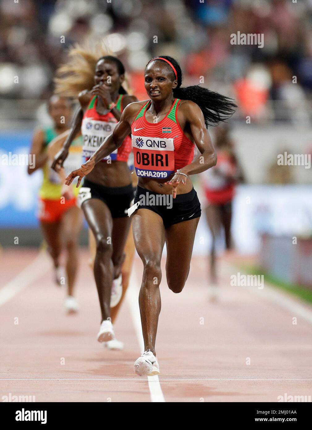 Hellen Obiri, of Kenya races to win the gold medal in the women's 5000 ...