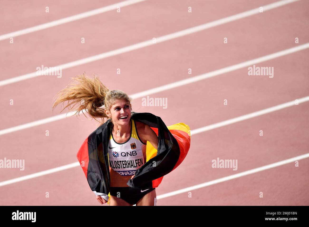 Konstanze Klosterhalfen, of Germany, celebrates after winning the ...