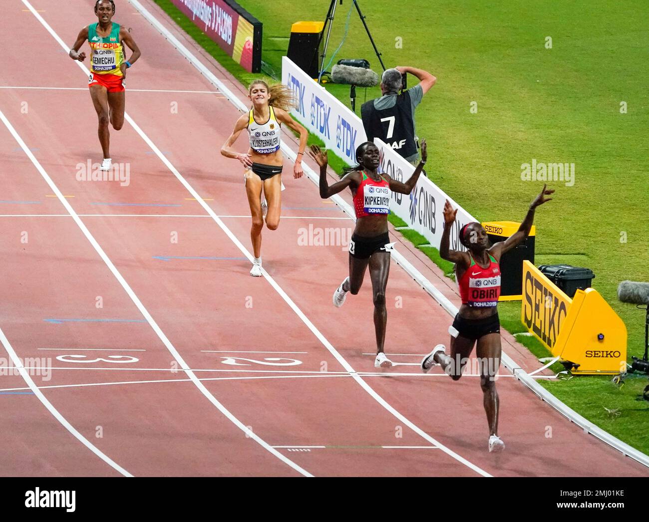 Hellen Obiri, of Kenya, reacts after winning the women's 5000 meter ...