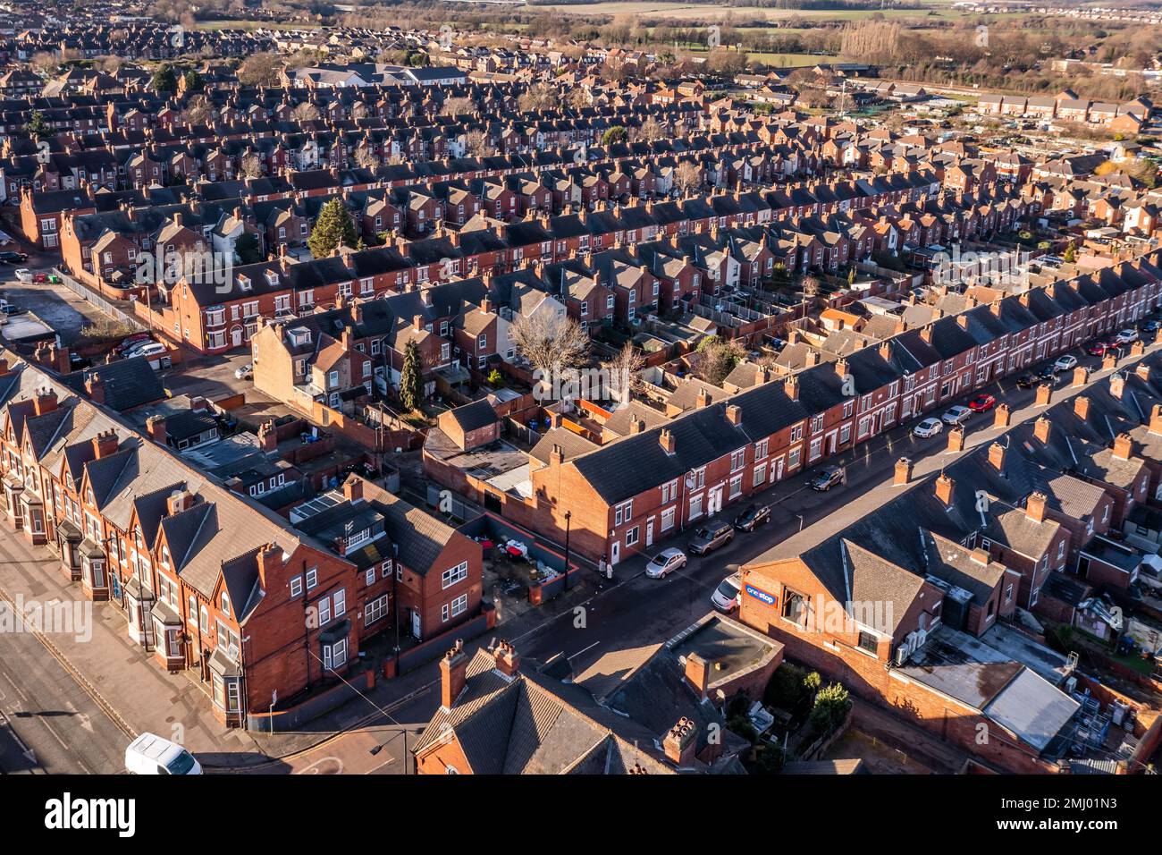 An aerial view of the rooftops of rows of back to back terraced houses ...