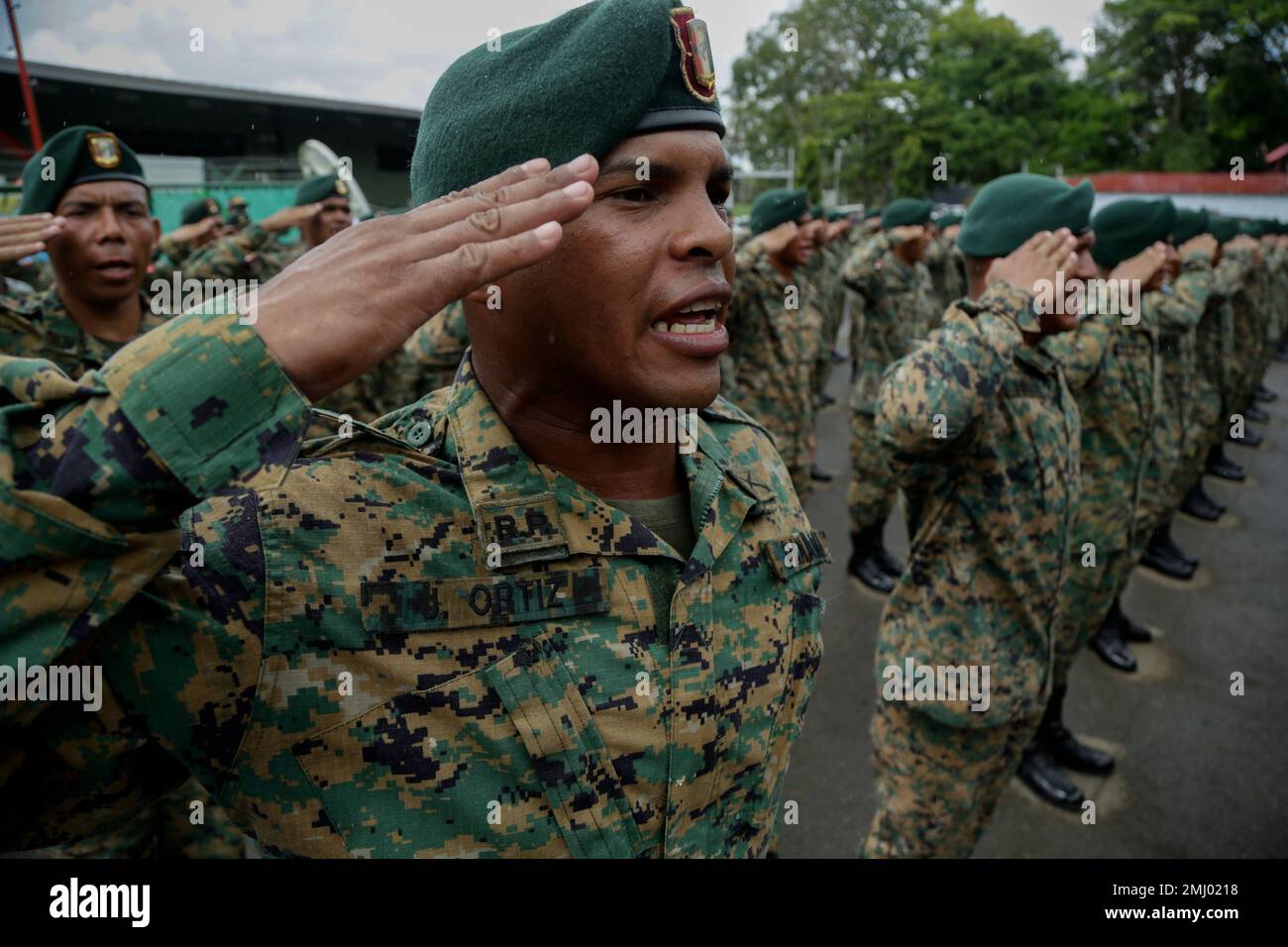 Newly graduated border police officers salute during their graduation ...