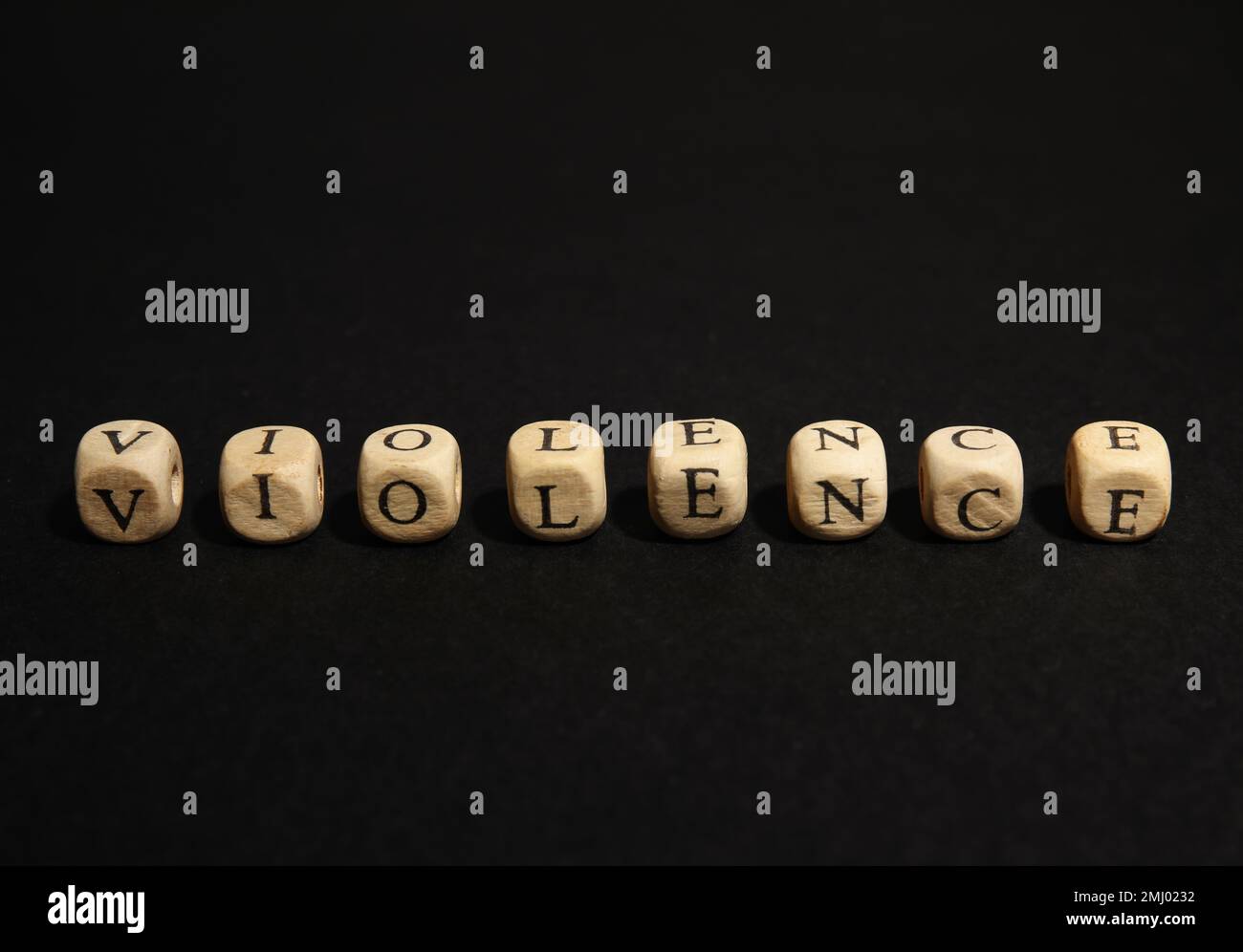 Word VIOLENCE made of wooden cubes on black background Stock Photo - Alamy