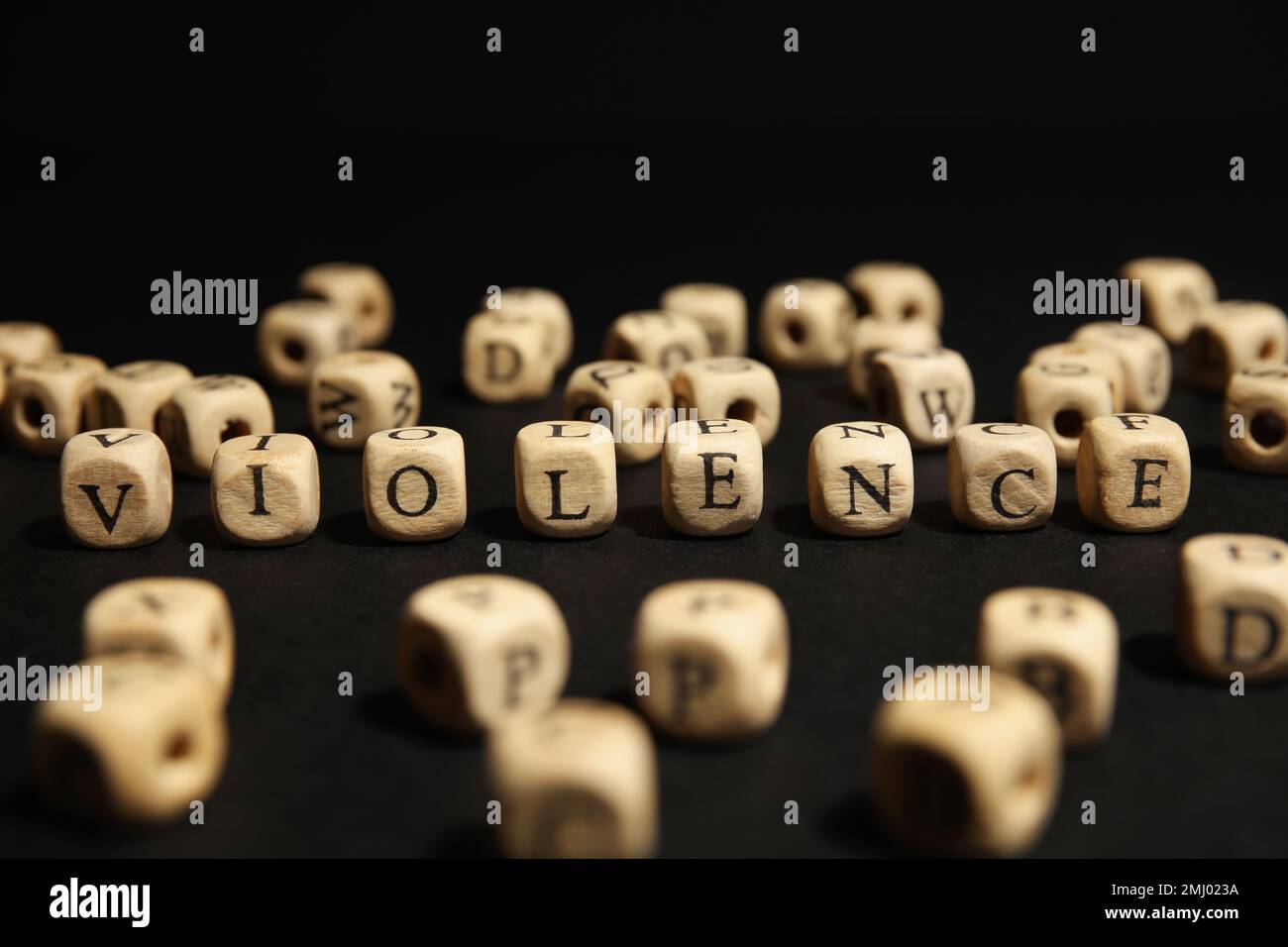 Word VIOLENCE made of wooden cubes on black background Stock Photo - Alamy