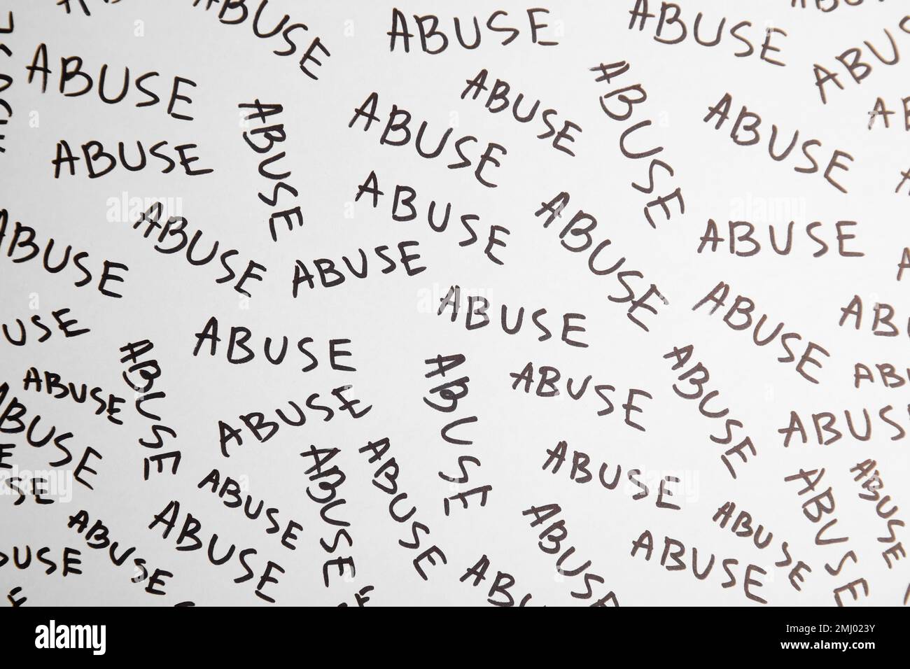 Sheet of paper with words ABUSE, top view. Domestic violence awareness ...