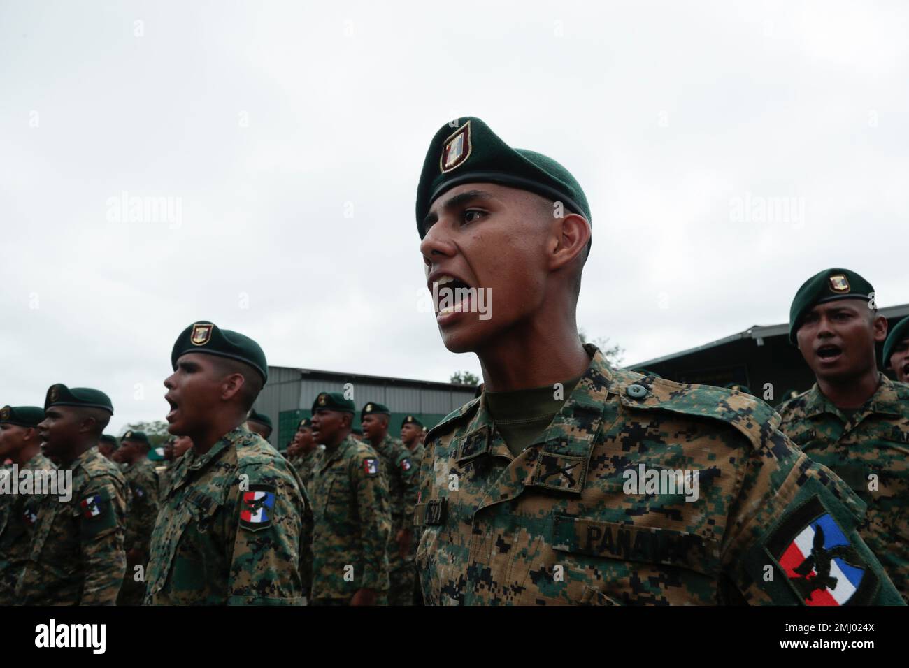 Newly graduated border police officers sing the national anthem during ...