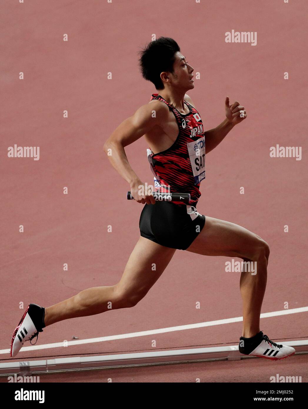 Japan's Kentaro Sato races in a men's 4x400 meter relay heat at the ...
