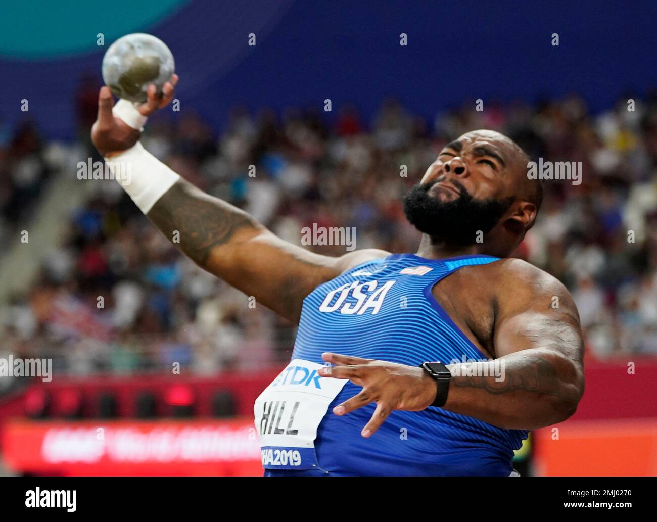 Darrell Hill, of the United States, competes in the men's shot put ...