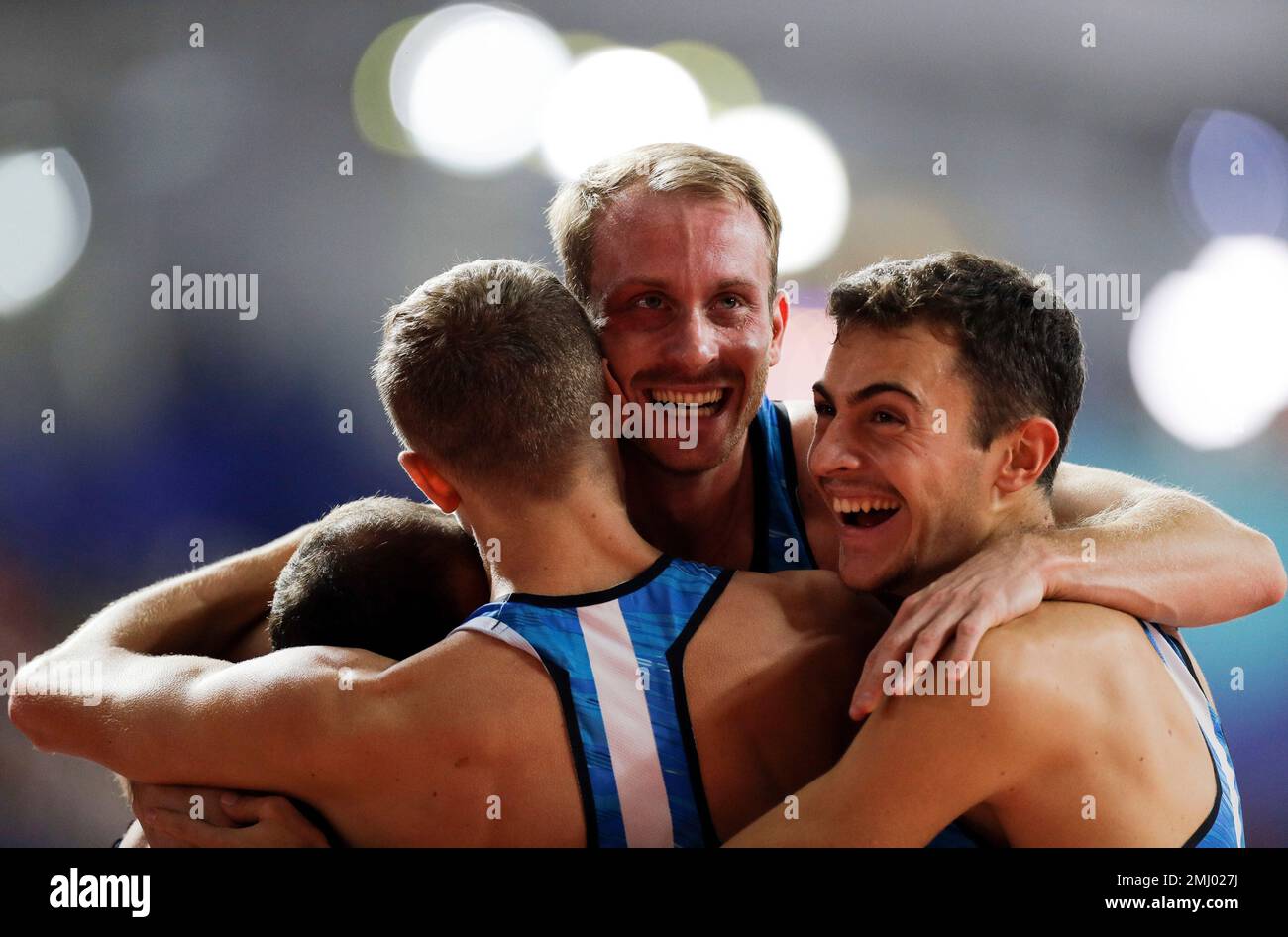 The Italian team celebrate after finishing a men's 4x400 meter relay ...