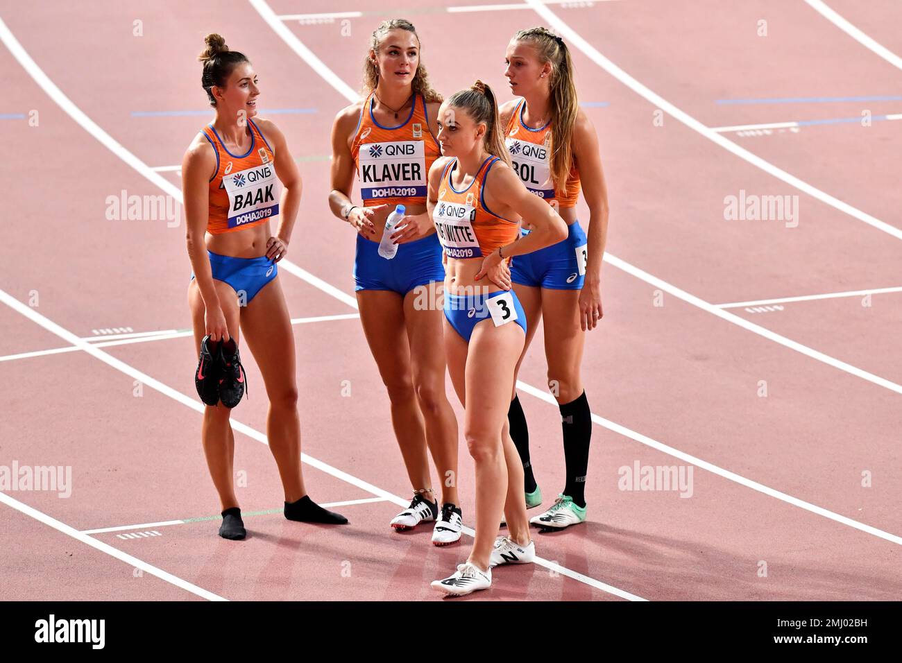 The team of the Netherlands reacts after finishing fourth in their heat ...