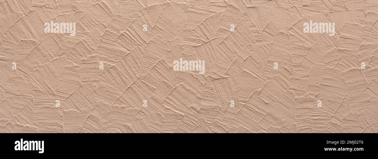 New light brown plaster with abstract design on a wall Stock Photo - Alamy