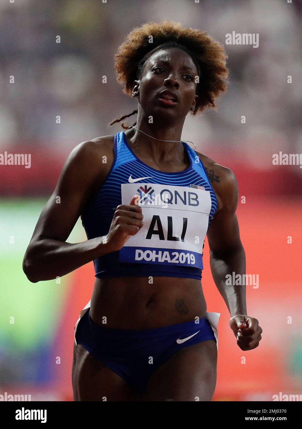 Nia Ali, of the United States after finishing a the women's 100 meter ...