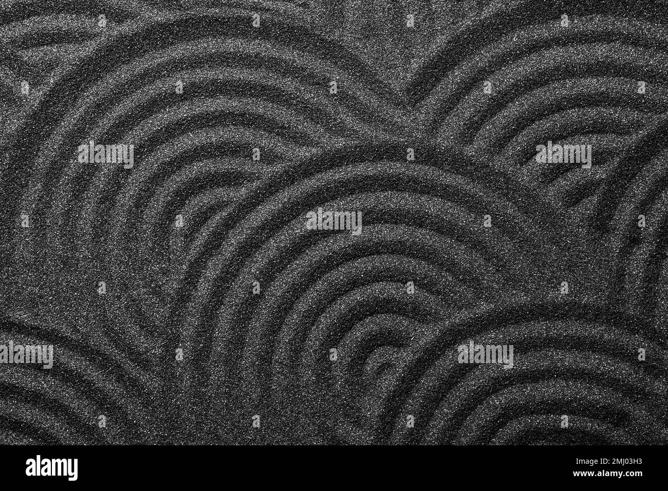Black sand with beautiful pattern, top view. Zen concept Stock Photo ...