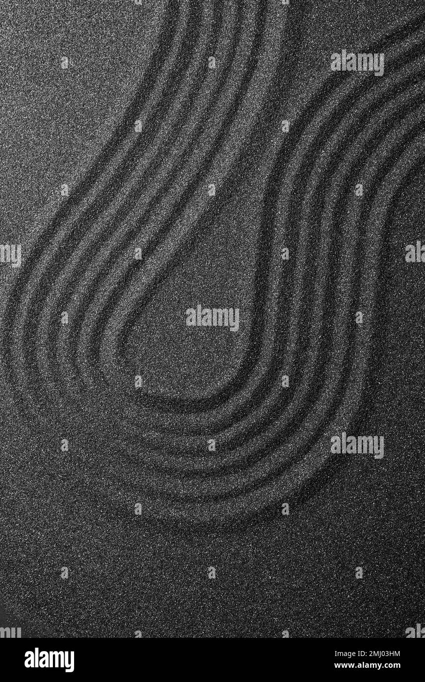 Black sand with beautiful pattern, top view. Zen concept Stock Photo ...