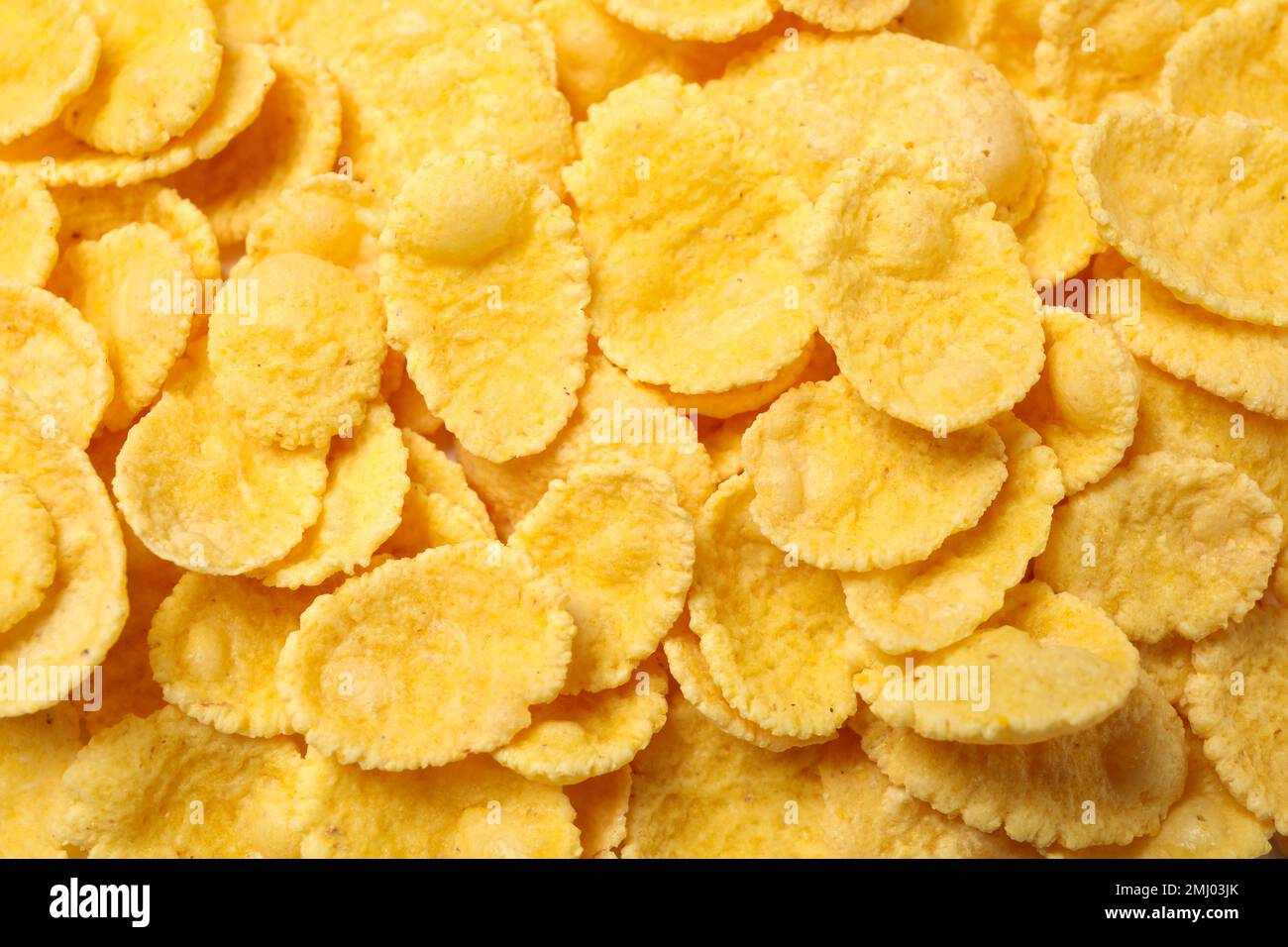 Tasty crispy corn flakes as background, top view Stock Photo - Alamy
