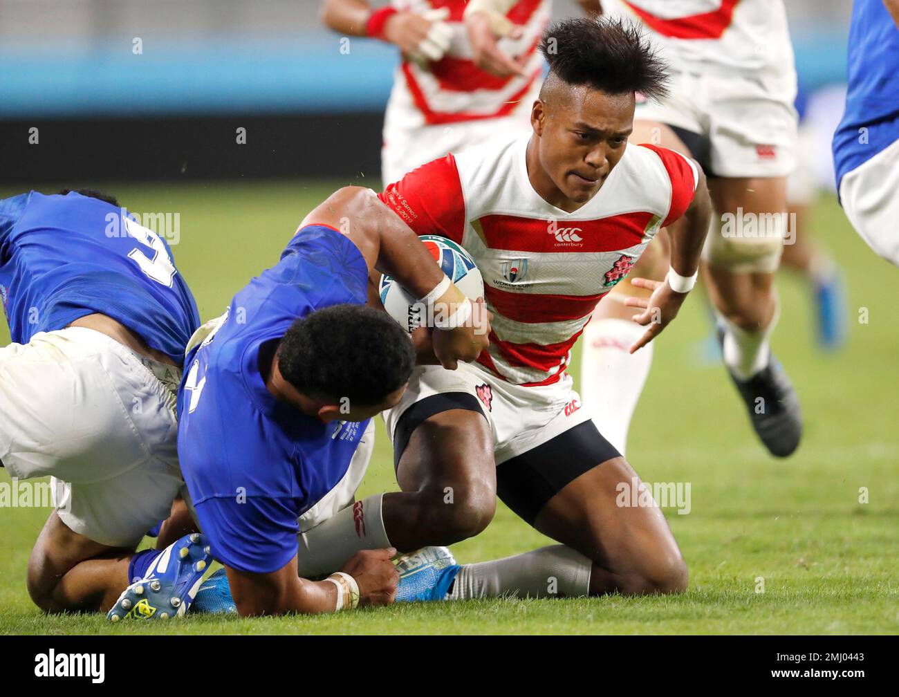 Japan's Kotaro Matsushima runs at that Samoan defense during the Rugby ...