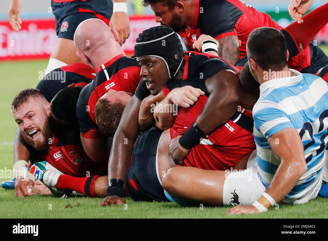 England's Luke Cowan-Dickie, left bottom, scores a try against ...