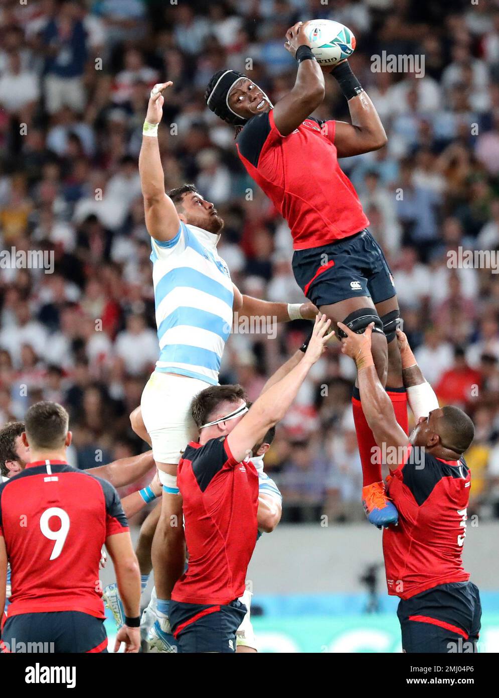 England's Maro Itoje, right, wins the lineout ball from Argentina's ...