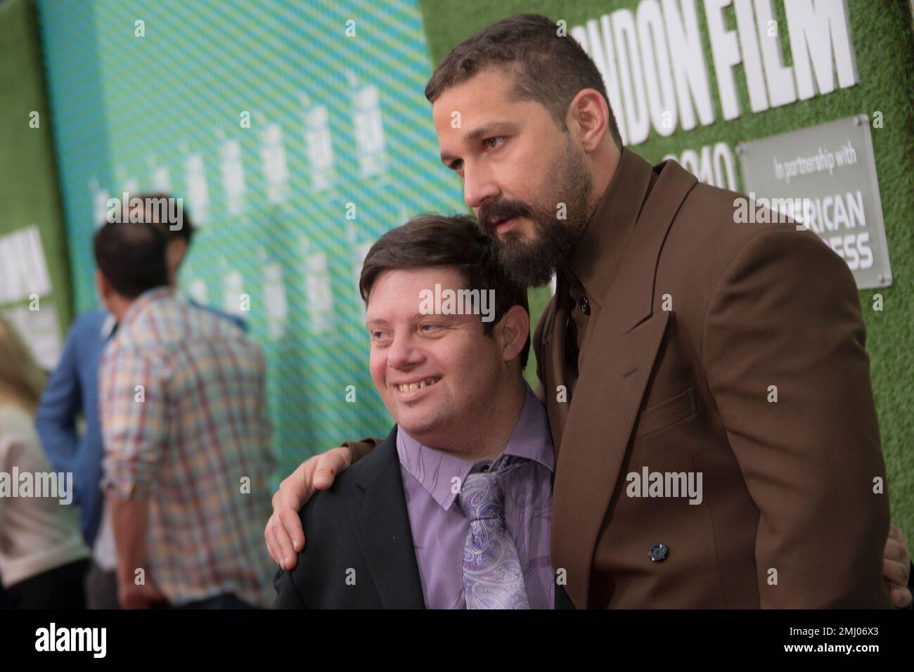 Zack Gottsagen and Shia LaBeouf pose for photographers upon arrival at ...