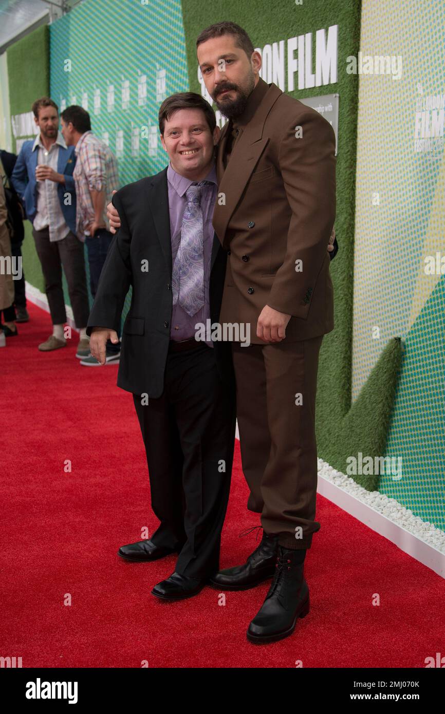 Zack Gottsagen and Shia LaBeouf pose for photographers upon arrival at ...