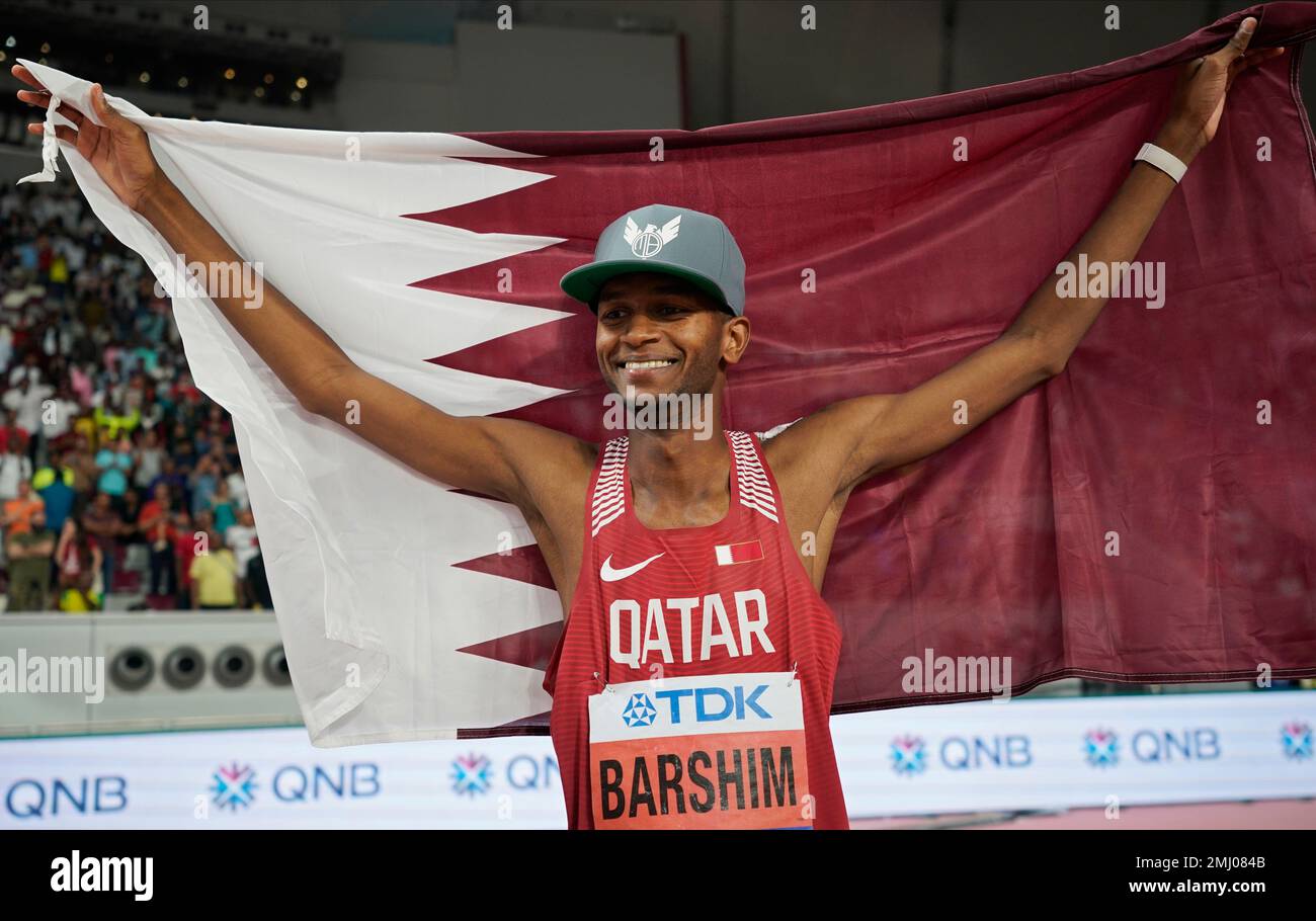 Gold medalist Mutaz Essa Barshim, of Qatar, celebrates after the men's ...