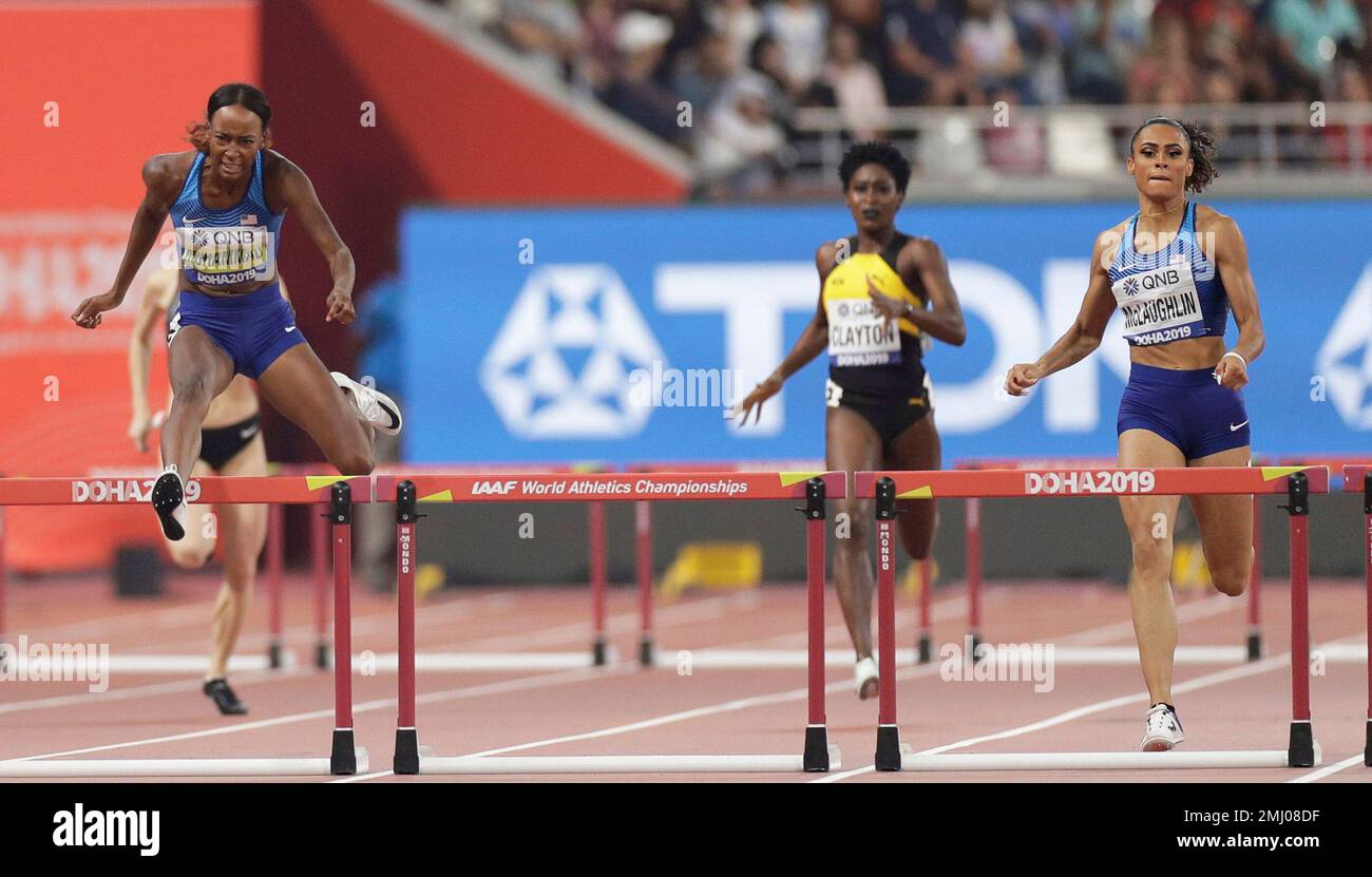 Dalilah Muhammad, of the United States, left, heads to win the gold ...