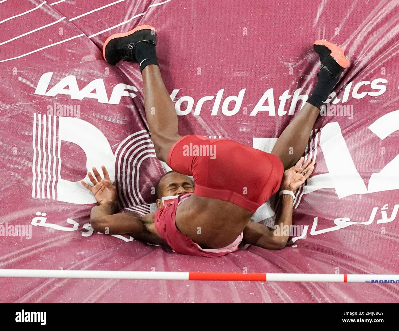Mutaz Essa Barshim, of Qatar, clears the bar during the men's high jump ...
