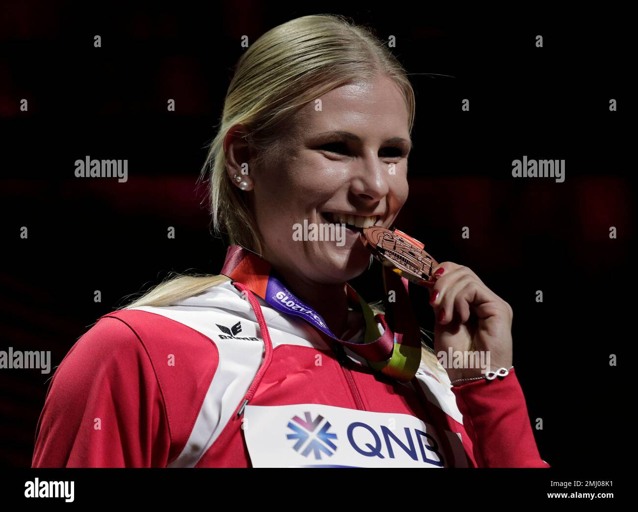 Verena Preiner of Austria, bites her bronze medal during the medal ...