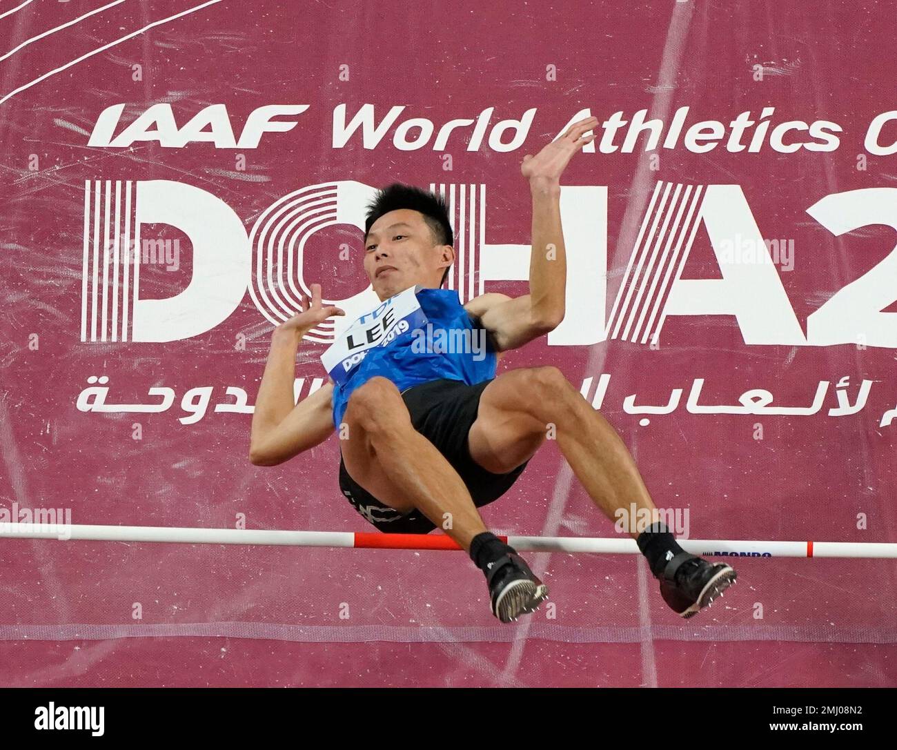 Hup Wei Lee, of Malaysia, clears the bar during the men's high jump ...