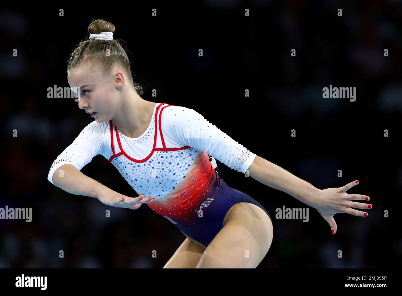 Aline Friess of France performs on the floor during qualifying sessions ...