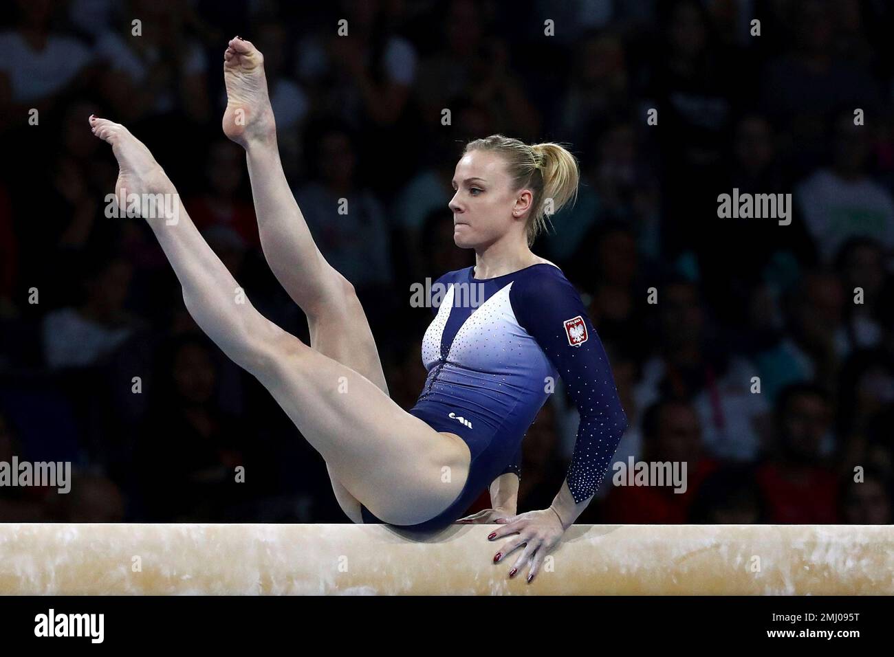 Gabriela Janik of Poland performs on the balance beam during qualifying ...