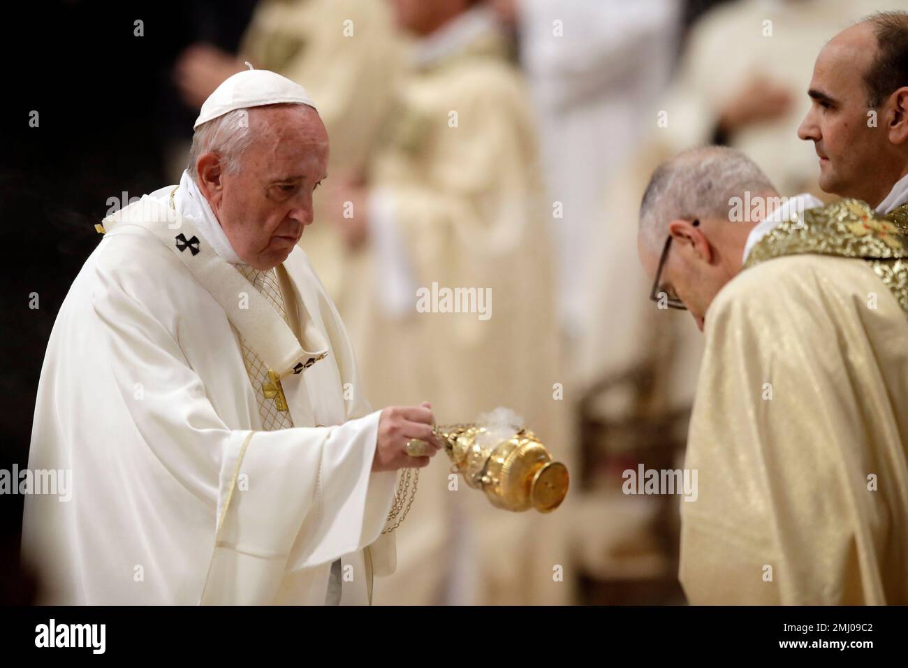 Pope Francis spreads incense as he leads a ceremony in which he ...