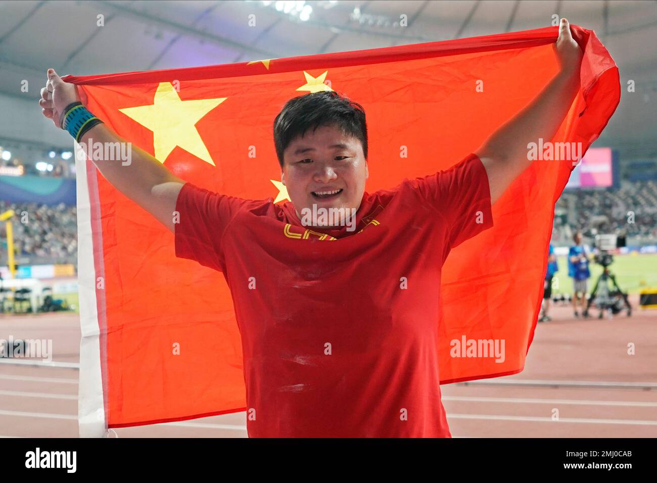 Lijiao Gong, of China, gold medalist in the shot put, celebrates at the ...