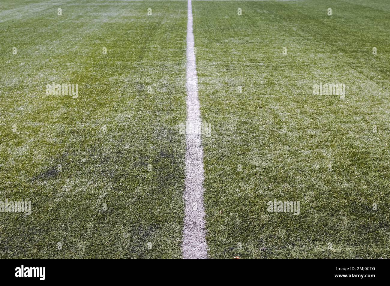Green football field at the city stadium Stock Photo - Alamy