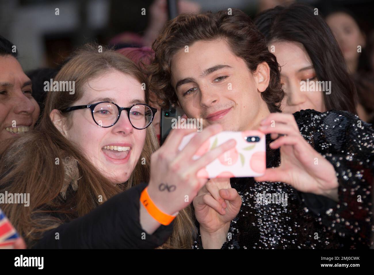 Actor Timothee Chalamet greets fans upon arrival at the premiere of the ...