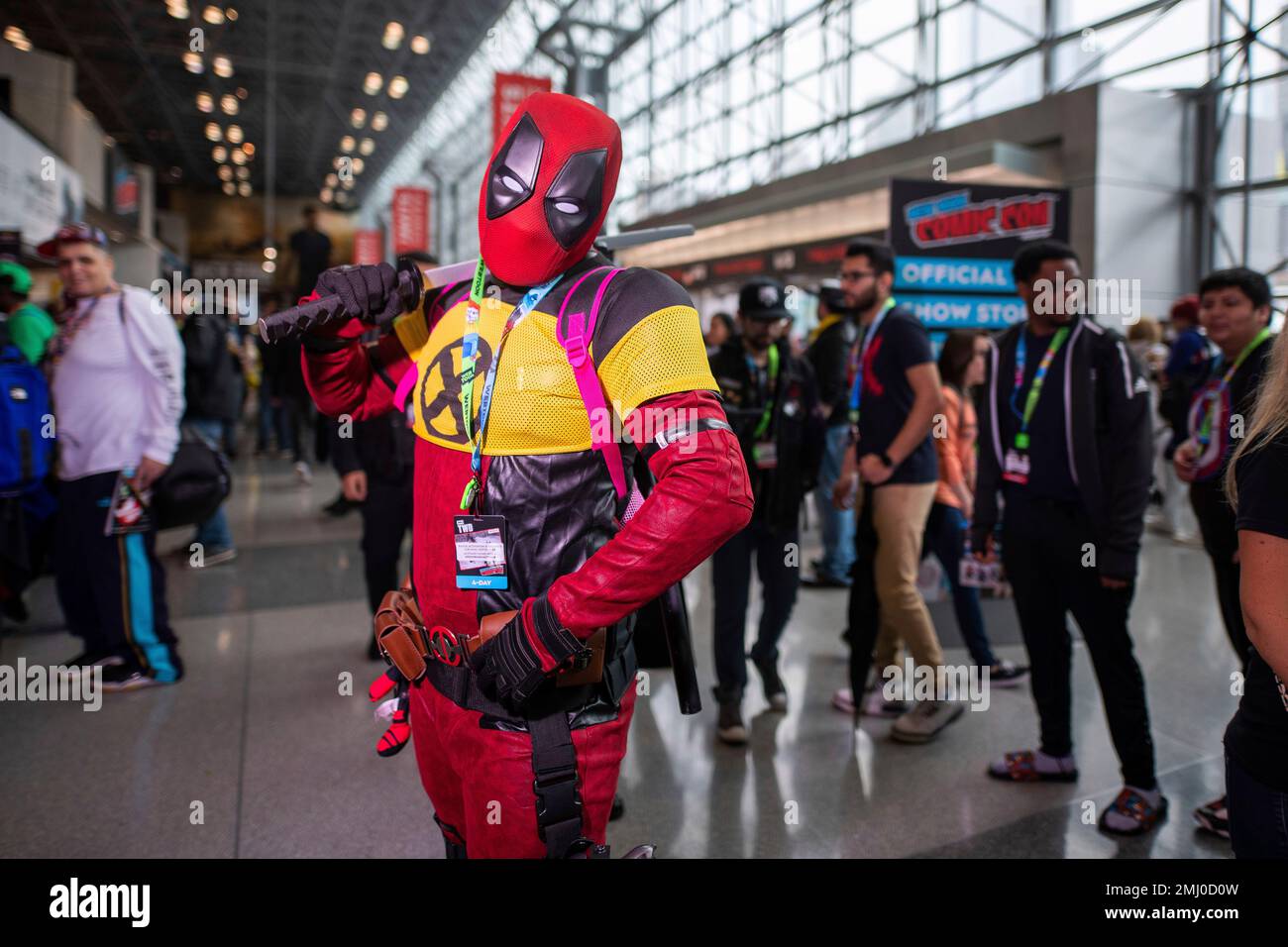 An attendee dressed as Deadpool poses during New York Comic Con at the ...