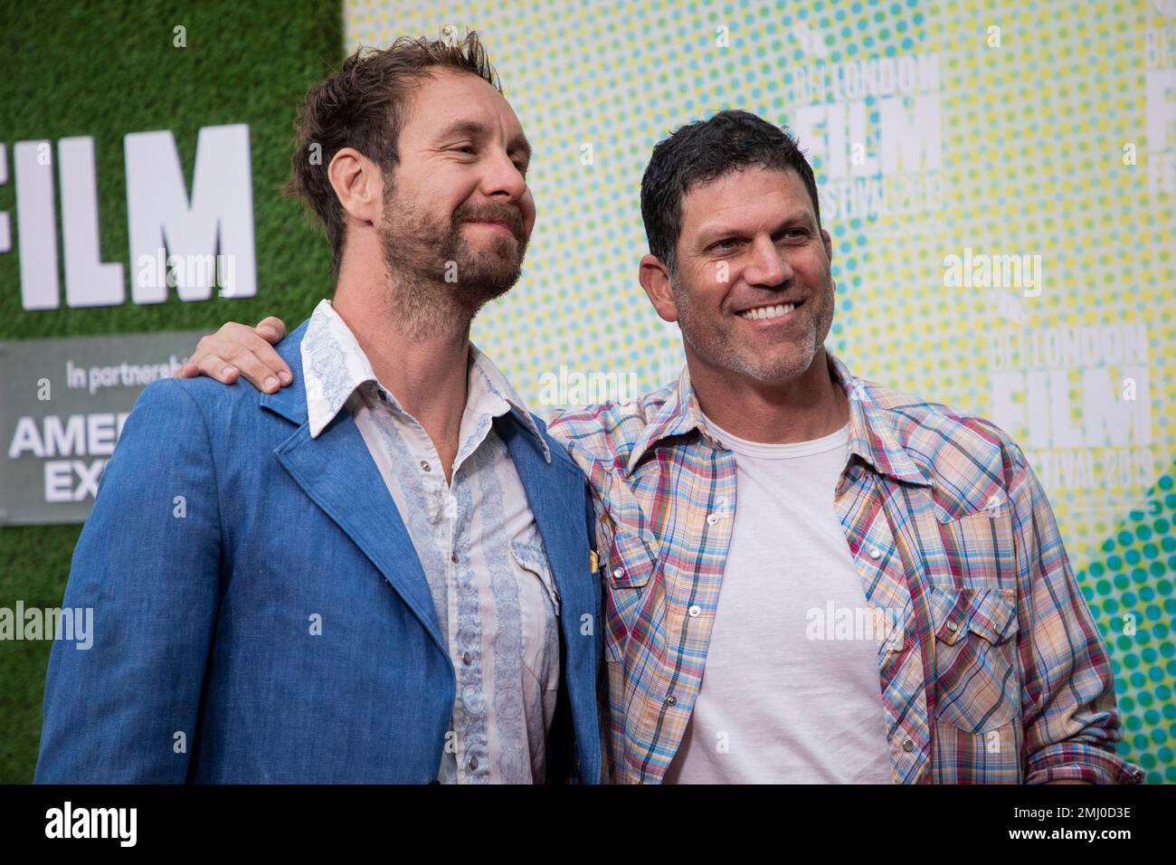 Tyler Nilson, left, and Michael Schwartz pose for photographers upon ...