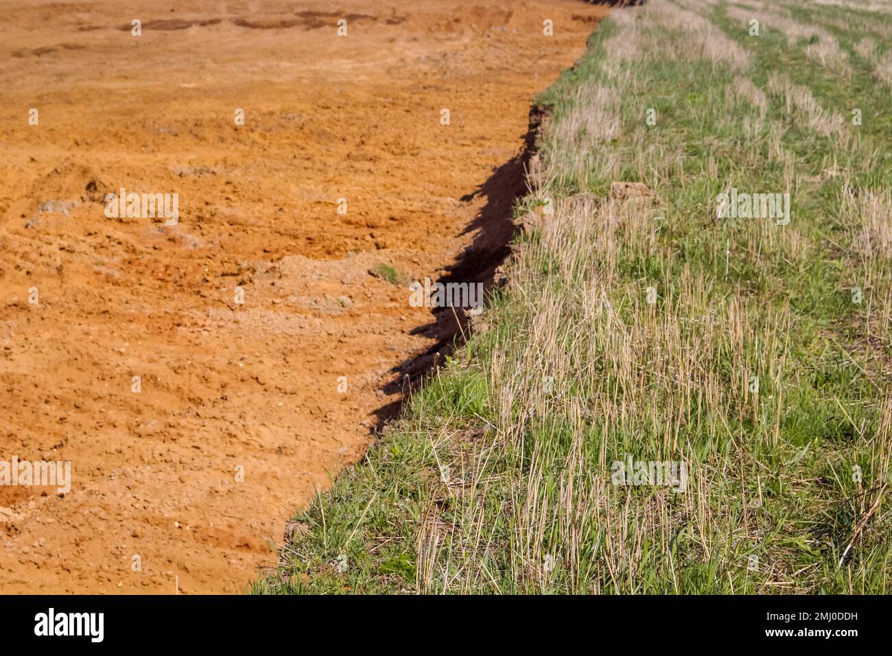 Mining. Sand pit on the former agricultural field. The boundary of the ...