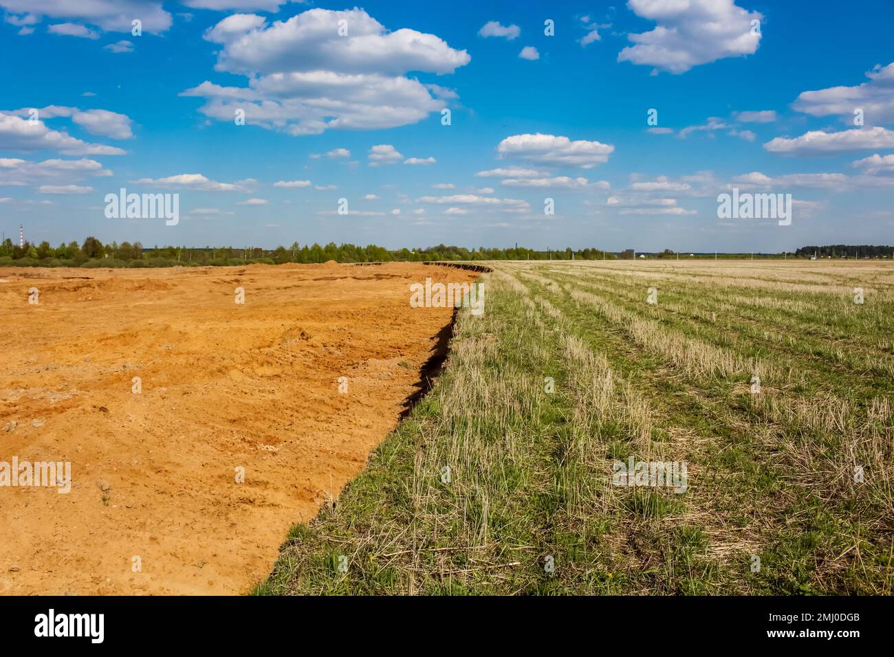 Mining. Sand pit on the former agricultural field. The boundary of the ...