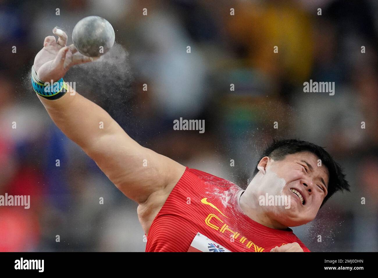 Lijiao Gong, of China, competes in the women's shot put final at the ...