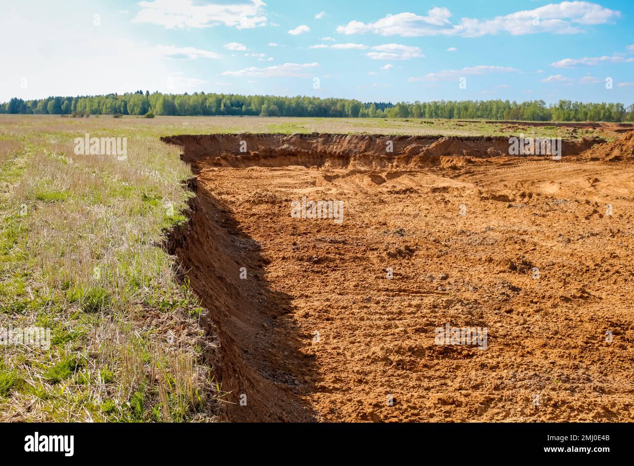 Mining. Sand pit on the former agricultural field. The boundary of the ...