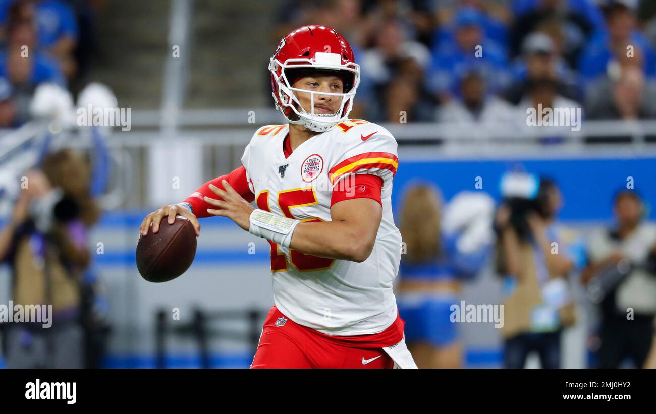 Kansas City Chiefs quarterback Patrick Mahomes rolls out to pass ...