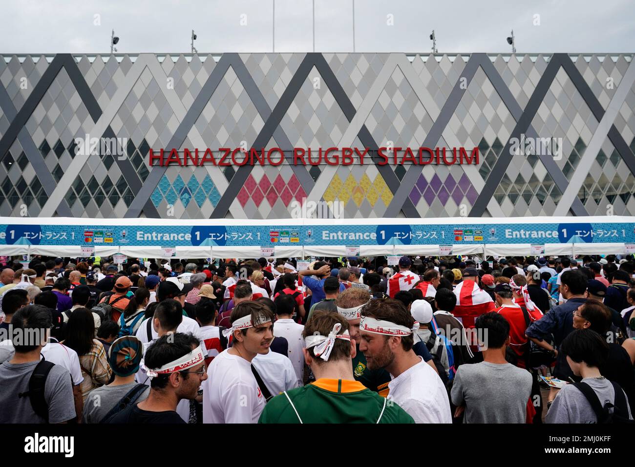 Fans wait outside Hanazono Stadium before the Rugby World Cup Pool D ...