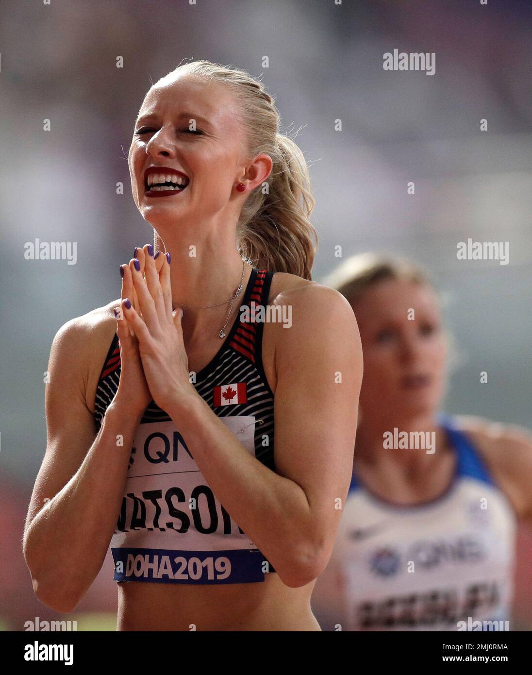 Sage Watson, of Canada reacts after finishing a women's 400 meter ...