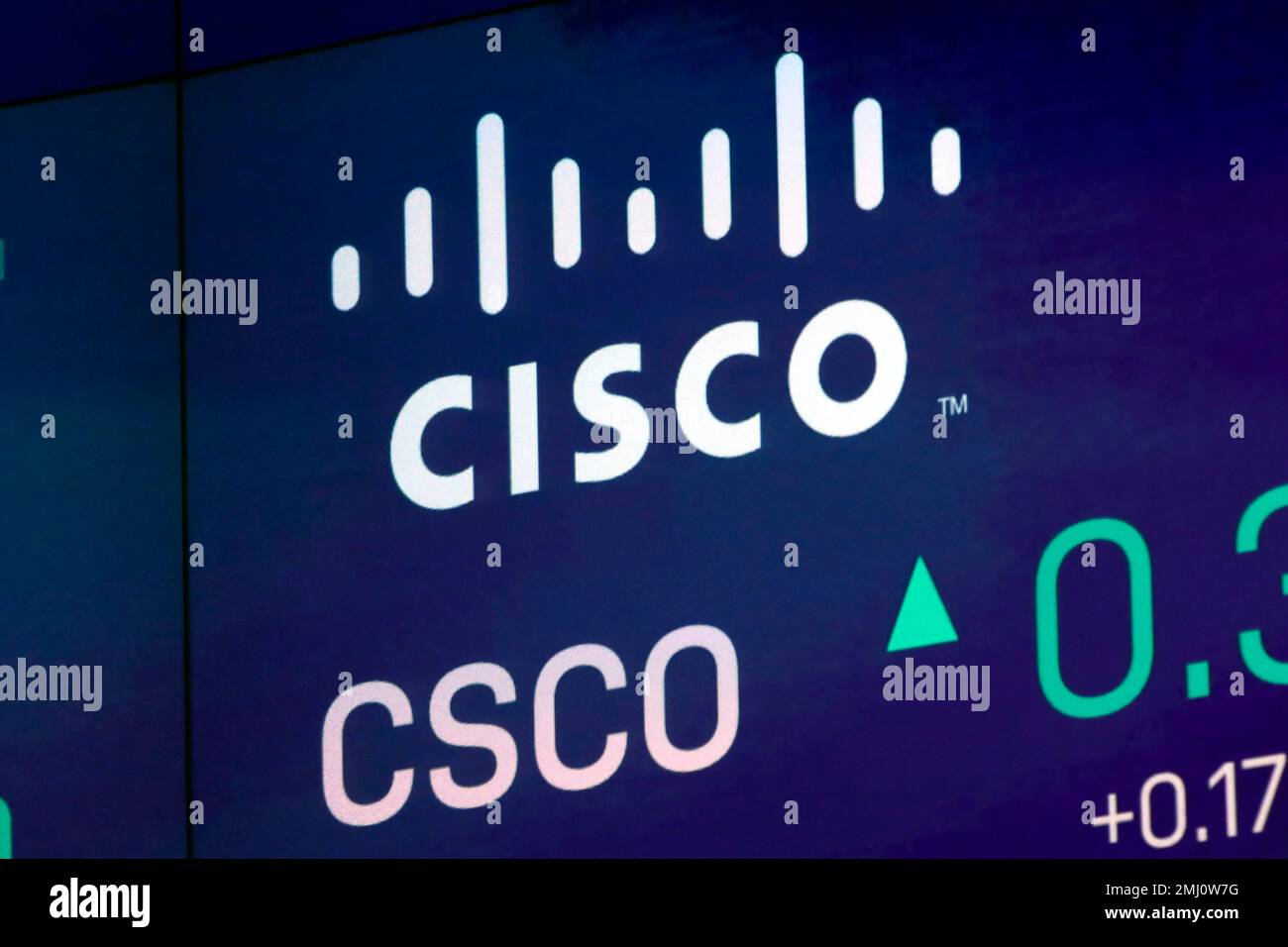 The symbol for Cisco appears on a screen at the Nasdaq MarketSite, in ...