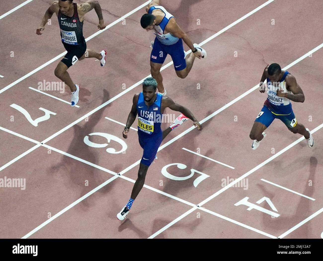 Noah Lyles of the United States crosses the finish line to win the men ...